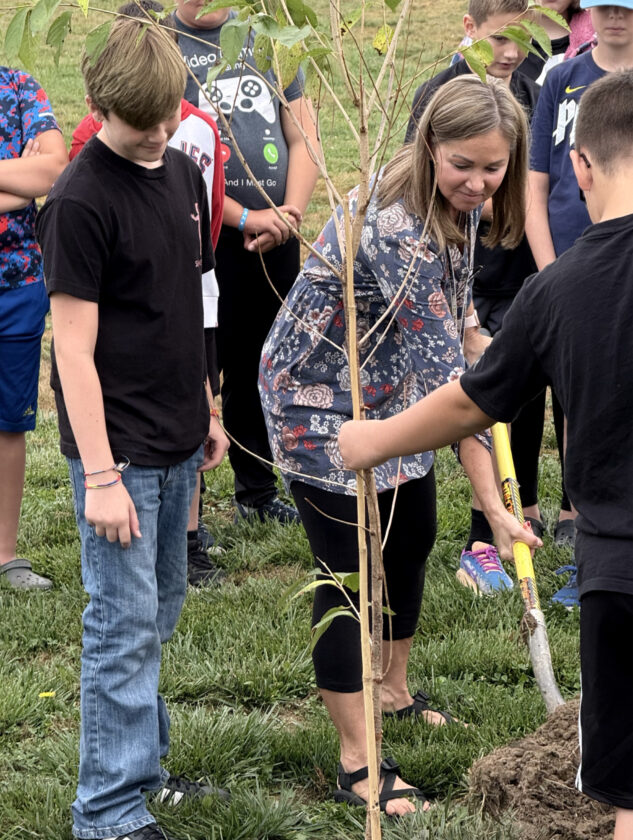 Middle school students plant Tree of Hope and Resilience on campus ...